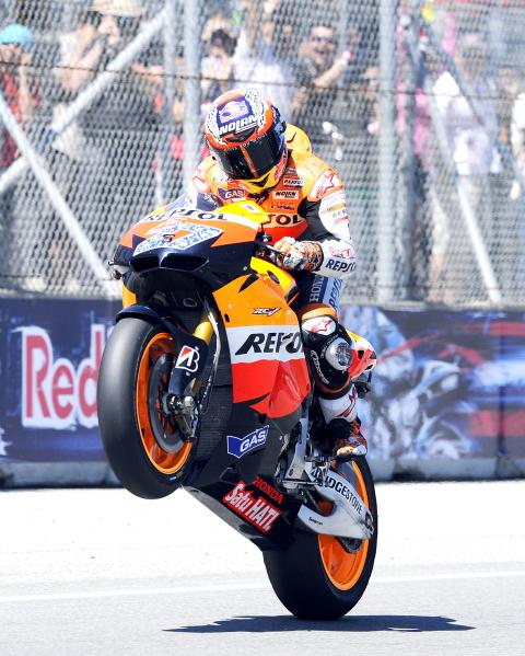 Stoner powers to fifth win of year at US Grand Prix - Taipei Times