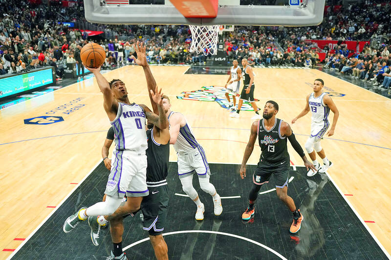 Kings defeat Clippers in double OT - Taipei Times